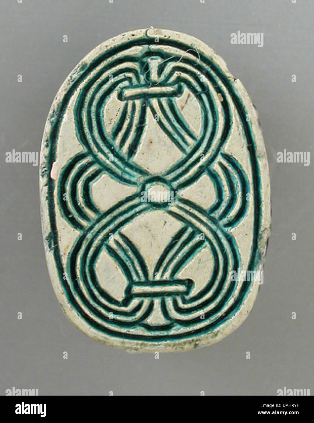 An ancient Egyptian scarab featuring an interwoven design, symbolizing ...