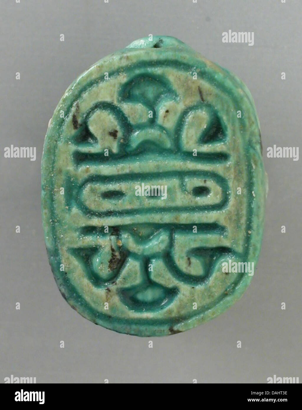 This scarab features a decorative motif of papyrus plants, common in ...