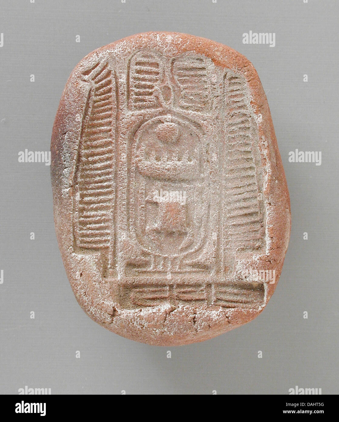 This seal impression or mold features the cartouche of Thutmose III, an ...
