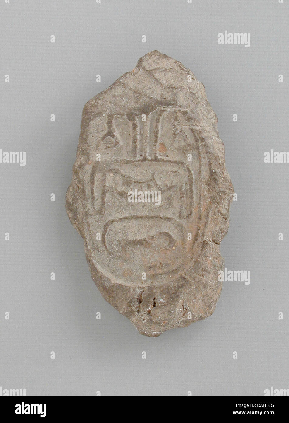 This seal impression features iconographic signs symbolizing prosperity ...