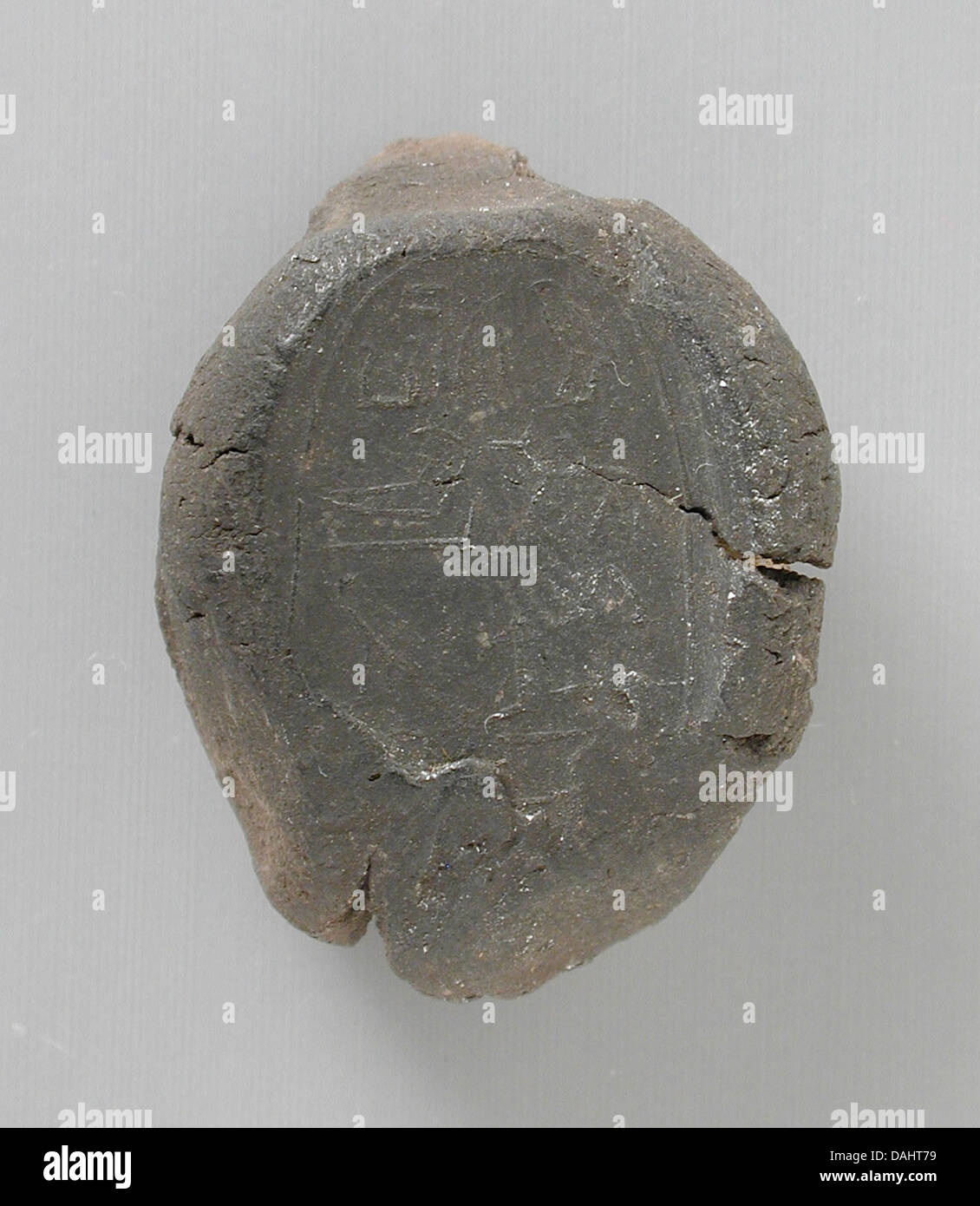 This seal impression displays the name of a private official, offering ...