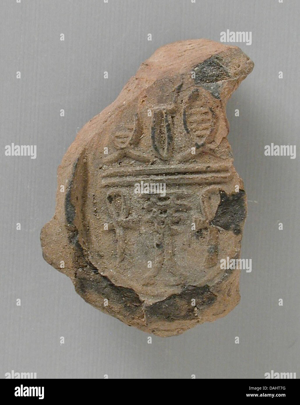 This seal impression, marked with signs of life and stability, reflects ...