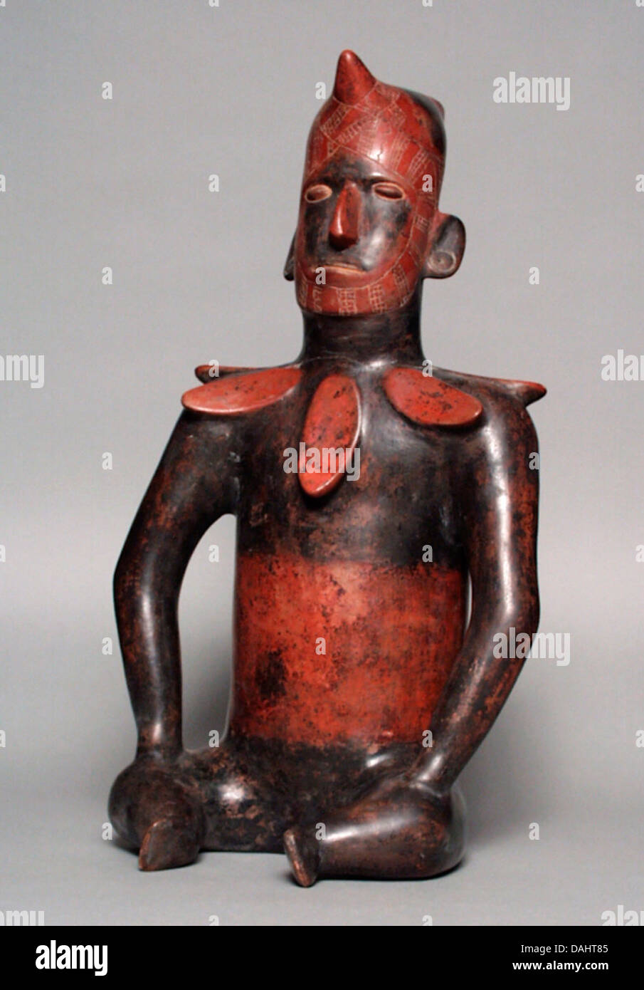 This seated figure represents a person in a relaxed yet poised posture ...