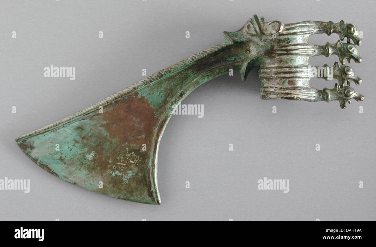 This ancient shaft-hole axehead, crafted from bronze, showcases early ...