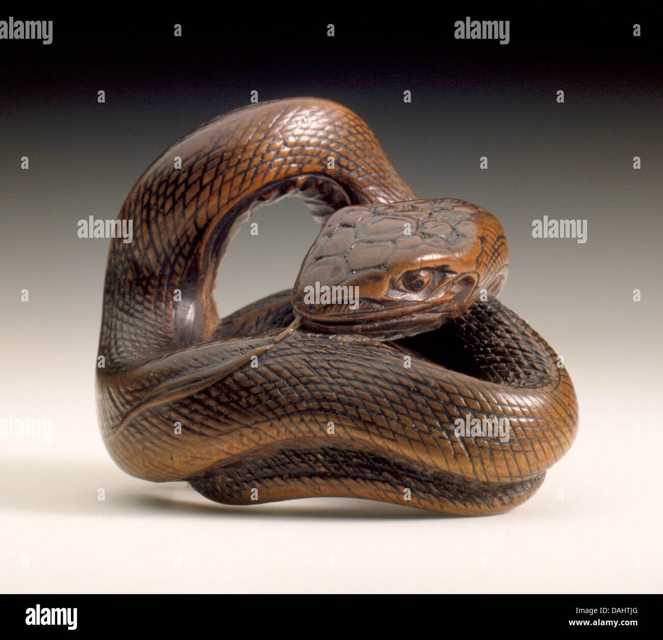 A bronze cast sculpture of a snake, part of the Jewelry and Adornments ...