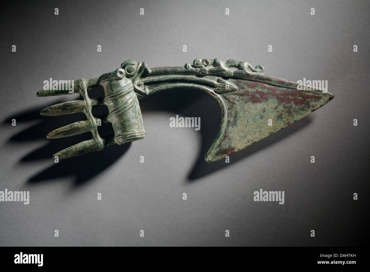 This spike-butted axehead is an example of ancient weaponry, showcasing ...