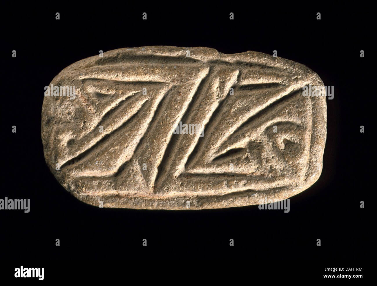 This ancient stamp seal, made from bronze, was used for engraving ...