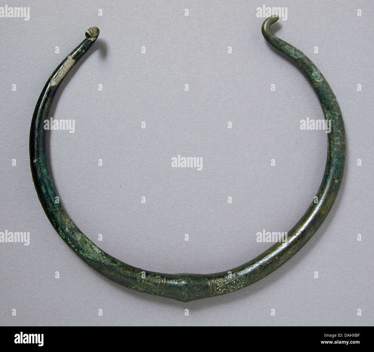 This torque is a type of neck ring, typically worn in ancient times as ...