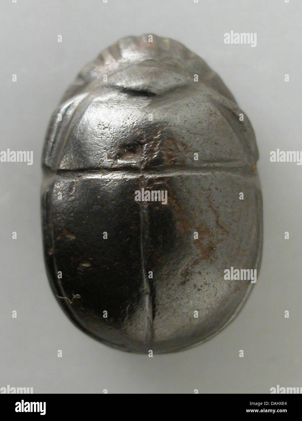 This uninscribed hematite scarab is an ancient Egyptian amulet ...