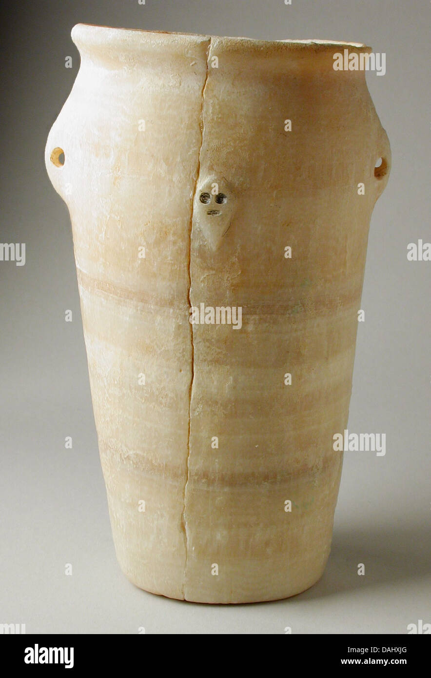 This vase is a finely crafted example of ancient ceramic art, featuring ...