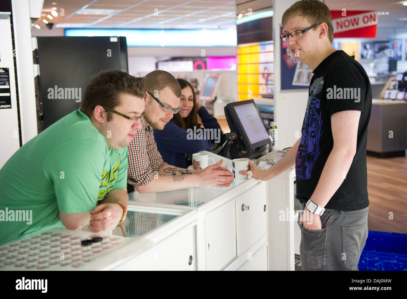 Members of staff during the closing down procedure in a Jessops store ...