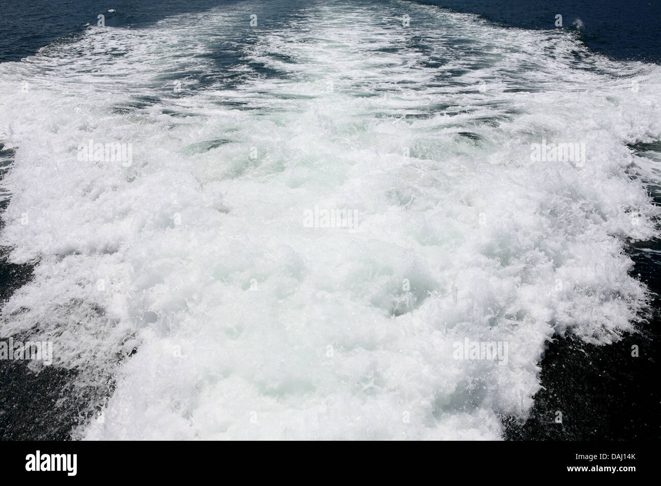 waves formed by the engine of a ship at sea Stock Photo - Alamy