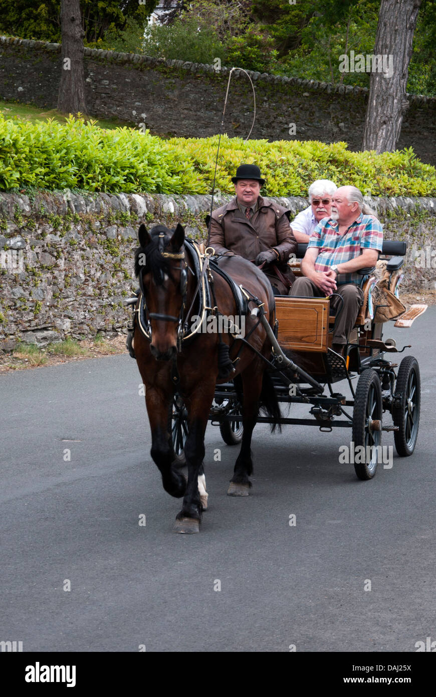Horse drawn carriage coachman passengers hi-res stock photography and ...