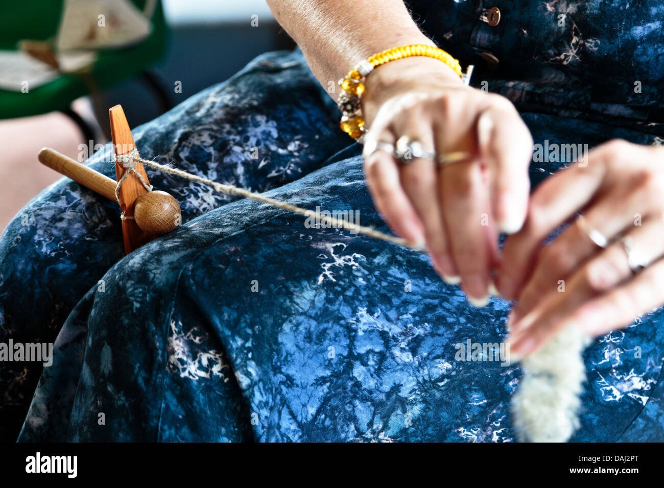 Woman knitting using stinging nettle fibers Stock Photo - Alamy