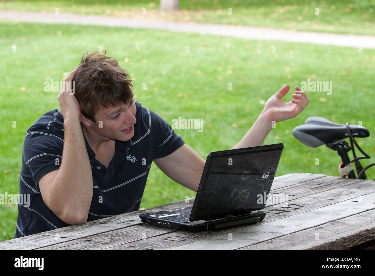 Student looking at computer with frustration Stock Photo - Alamy