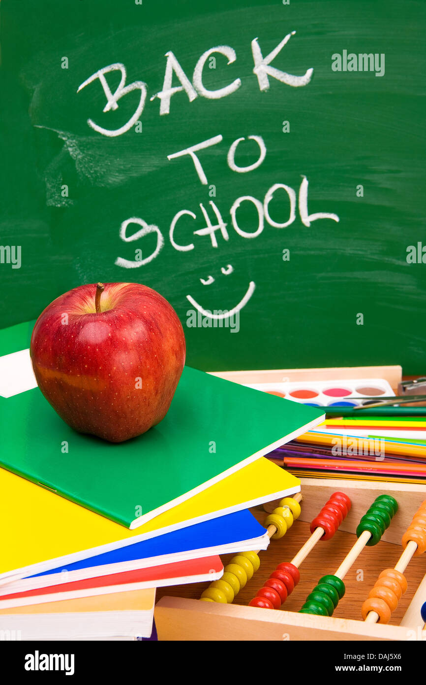 Back to school on chalkboard with school supplies Stock Photo - Alamy