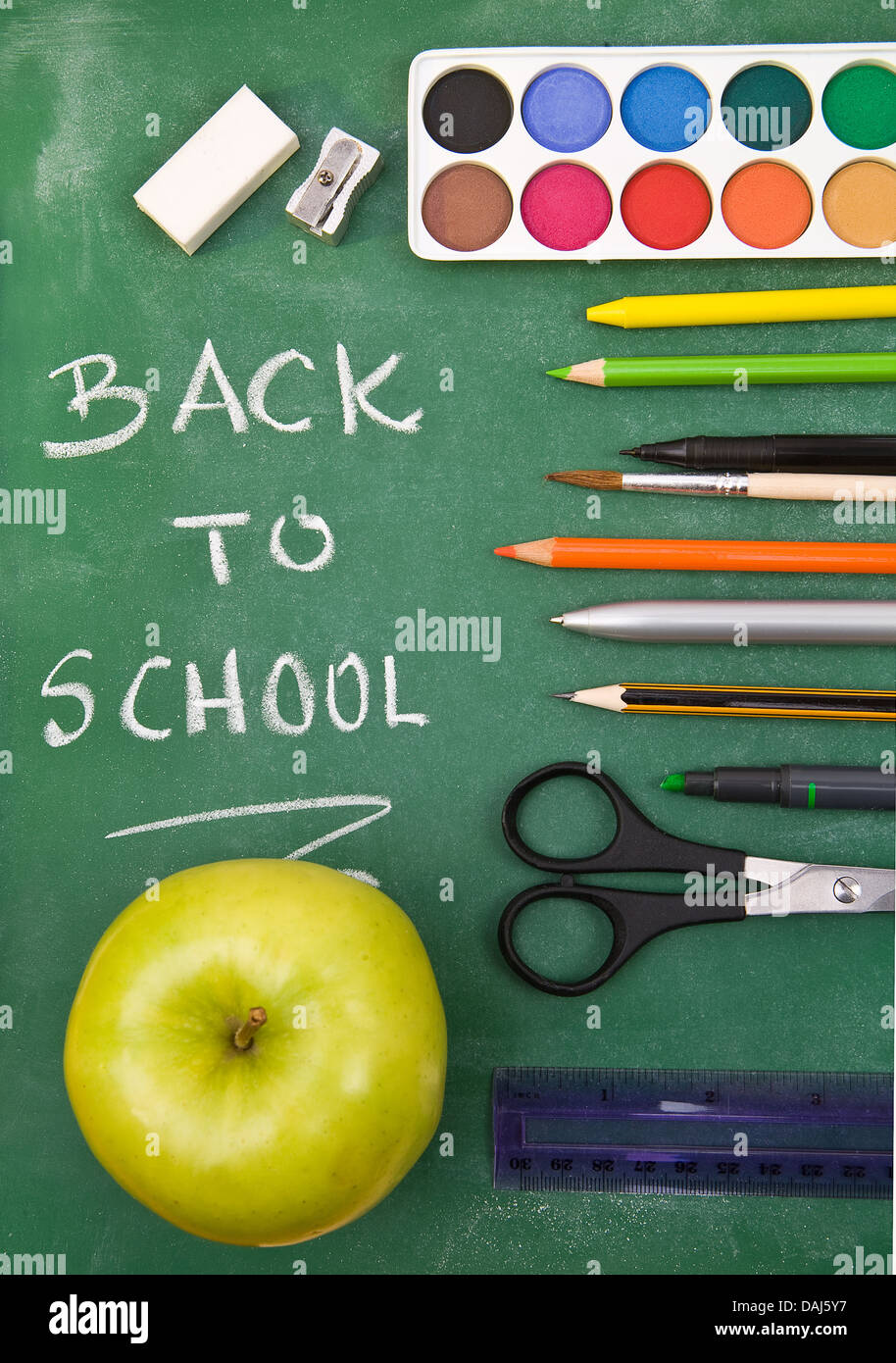 Back to school written on chalkboard with school supplies Stock Photo ...