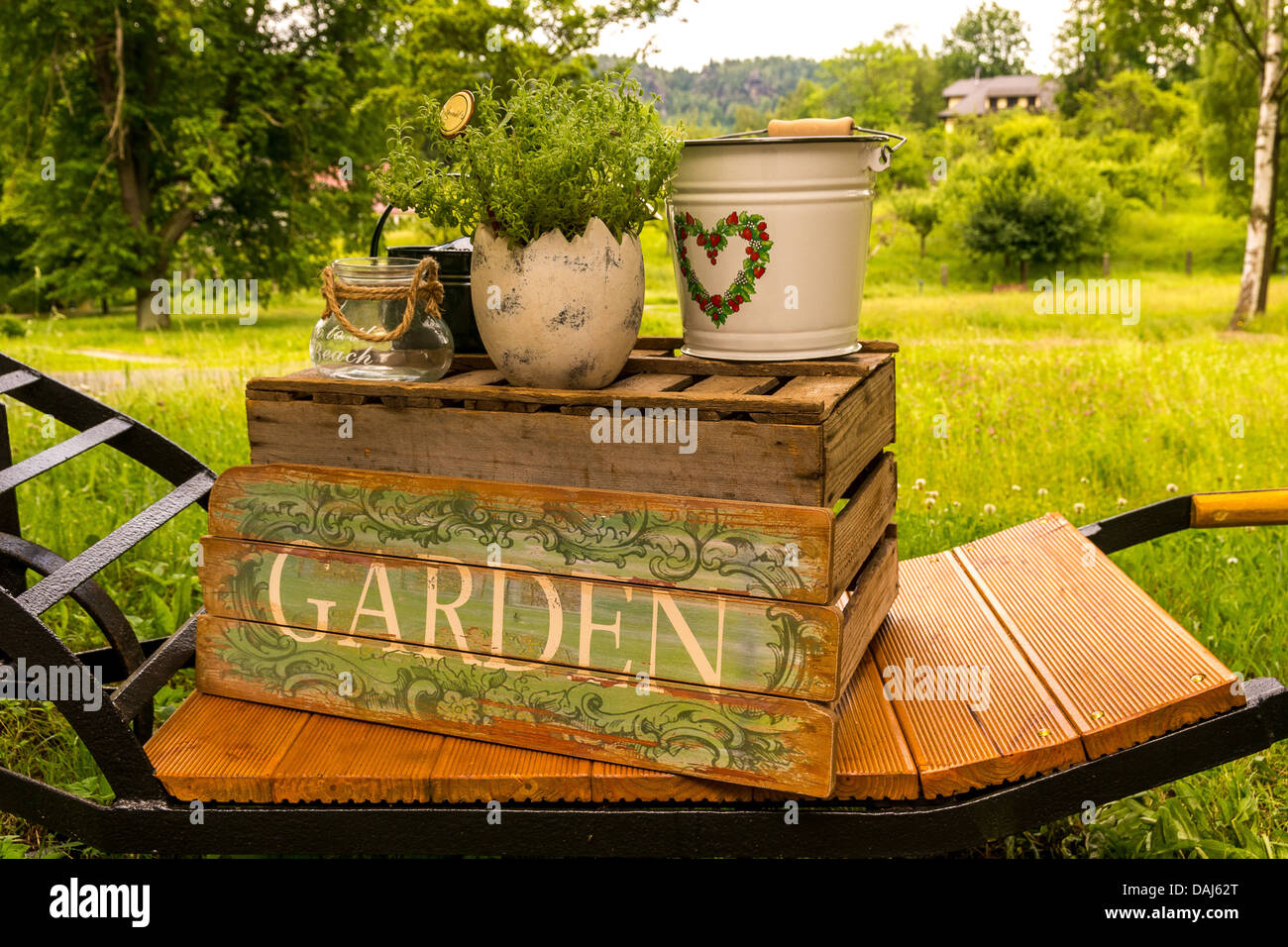 Garden, still life, flower pot, wheel barrow Stock Photo - Alamy