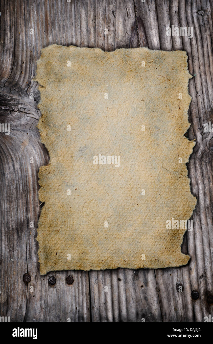 Old paper on rustic wooden background Stock Photo - Alamy