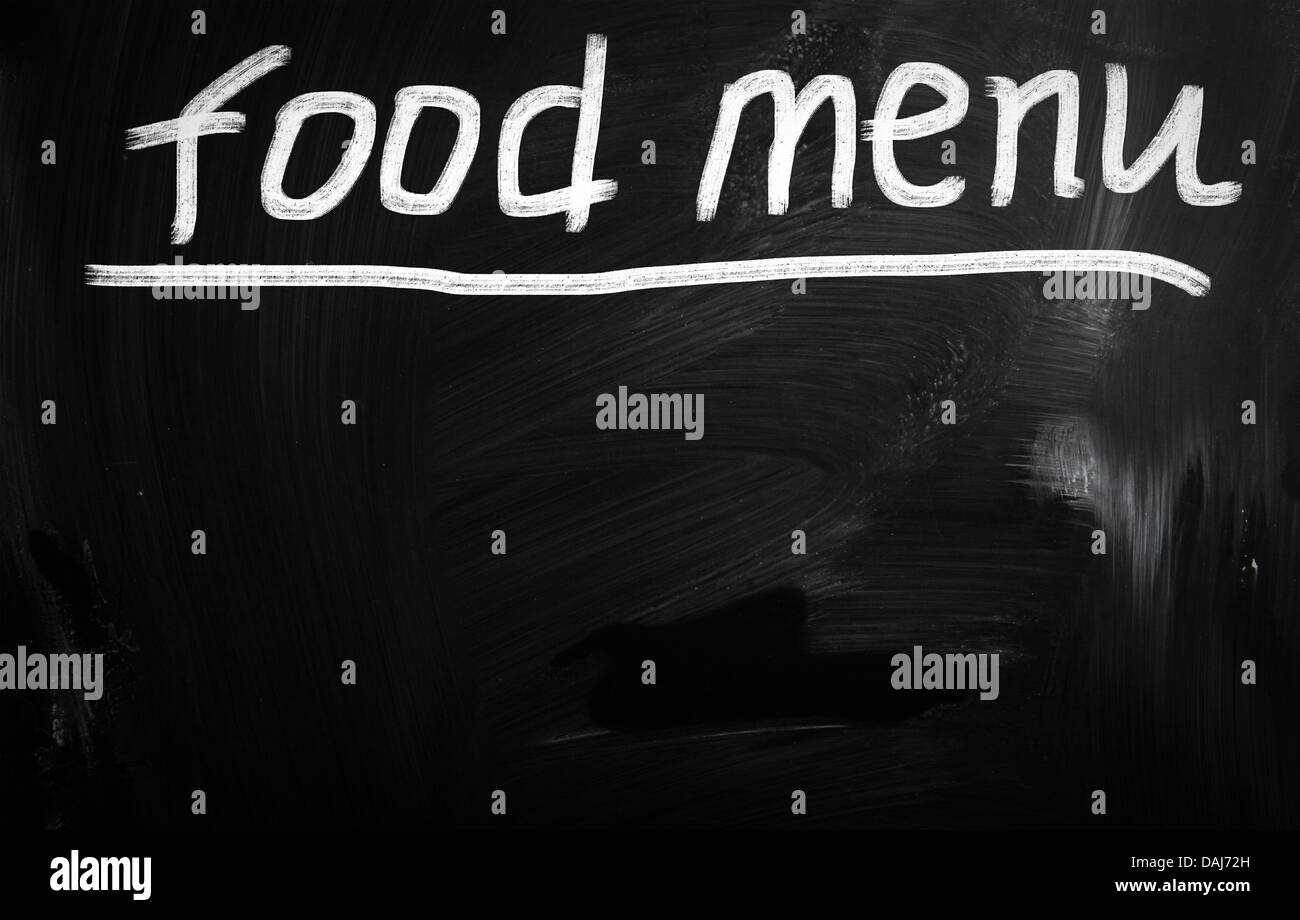 The word "Menu" handwritten with white chalk on a blackboard Stock ...