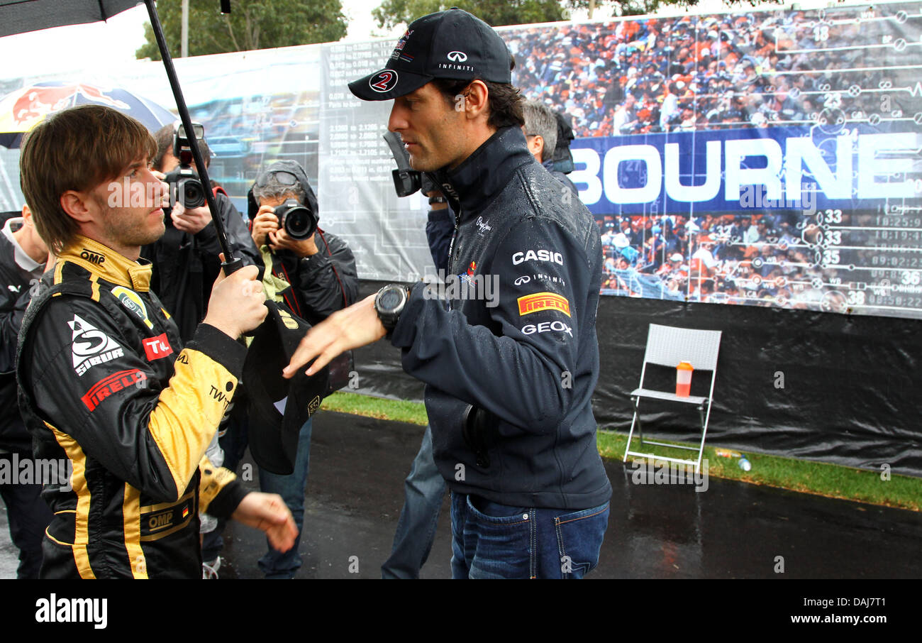 German Formula One driver Nick Heidfeld (L) of Renault talks to ...