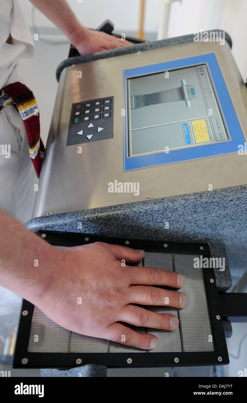 A person that has returned from Japan is examined on radiation exposure ...