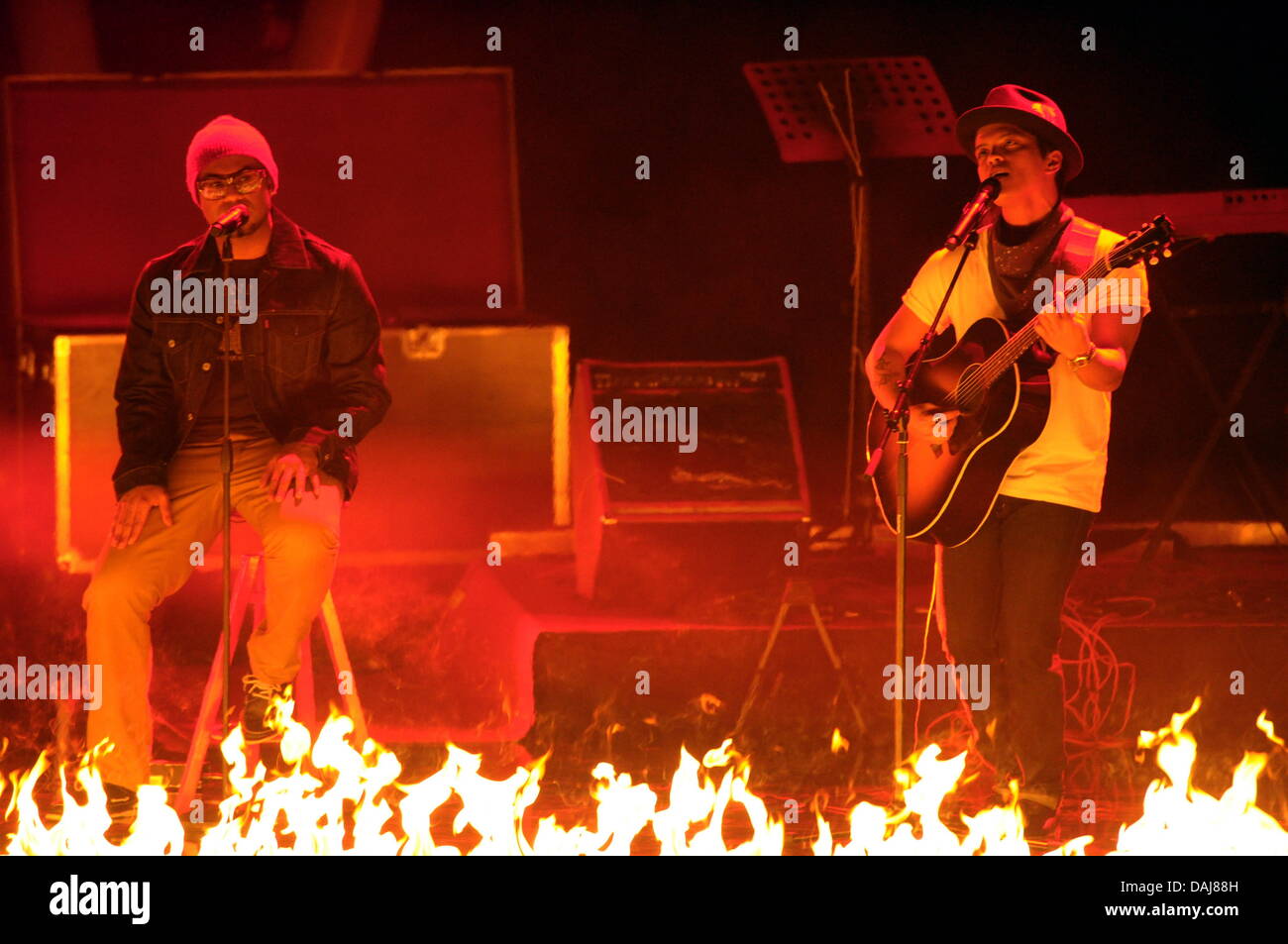 Hawaiian singer Bruno Mars (R) performs on stage during the 2011 Echo ...