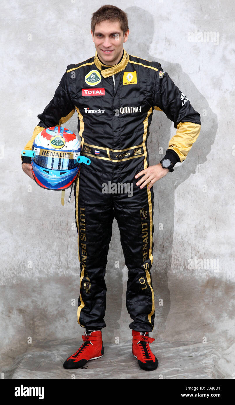 Russian Formula One driver Vitaly Petrov of Lotus Renault smiles during ...