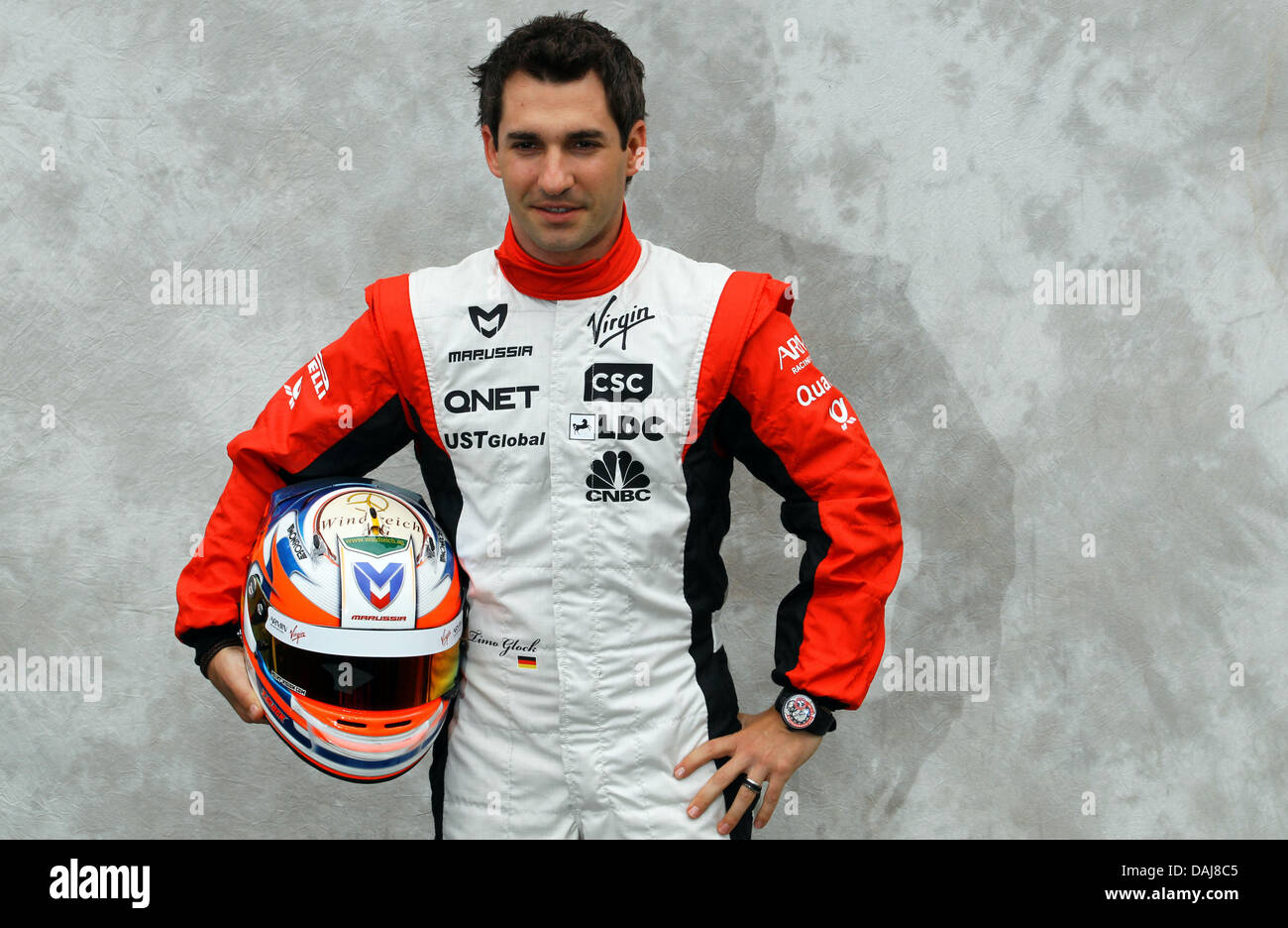 German Formula One driver Timo Glock of Virgin Racing smiles during the ...