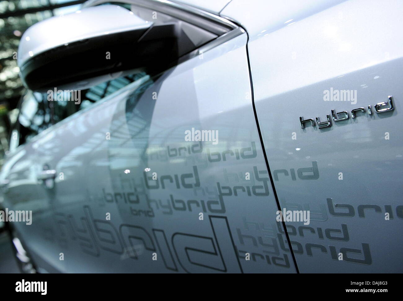 The picture shows a car with writing 'Hybrid' at the Volkswagen balance ...