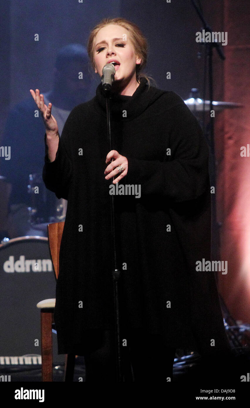 The picture shows the singer Adele performing at her first concert of ...