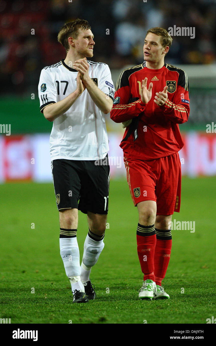 Germany's Per Mertesacker (L) and Manuel Neuer celebrate after UEFA ...