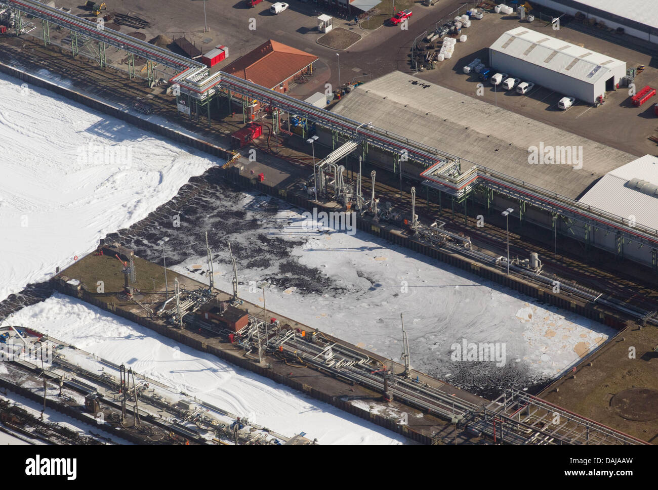 Aerial view on extinguishing foam covering the harbour basin of a BP ...