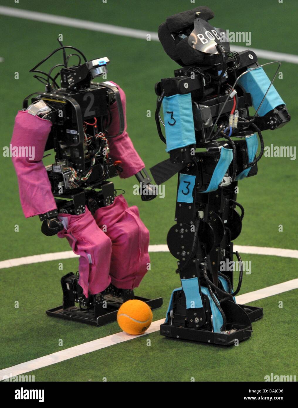 A robot developed by Darmstadt University of Technology (L) controls ...