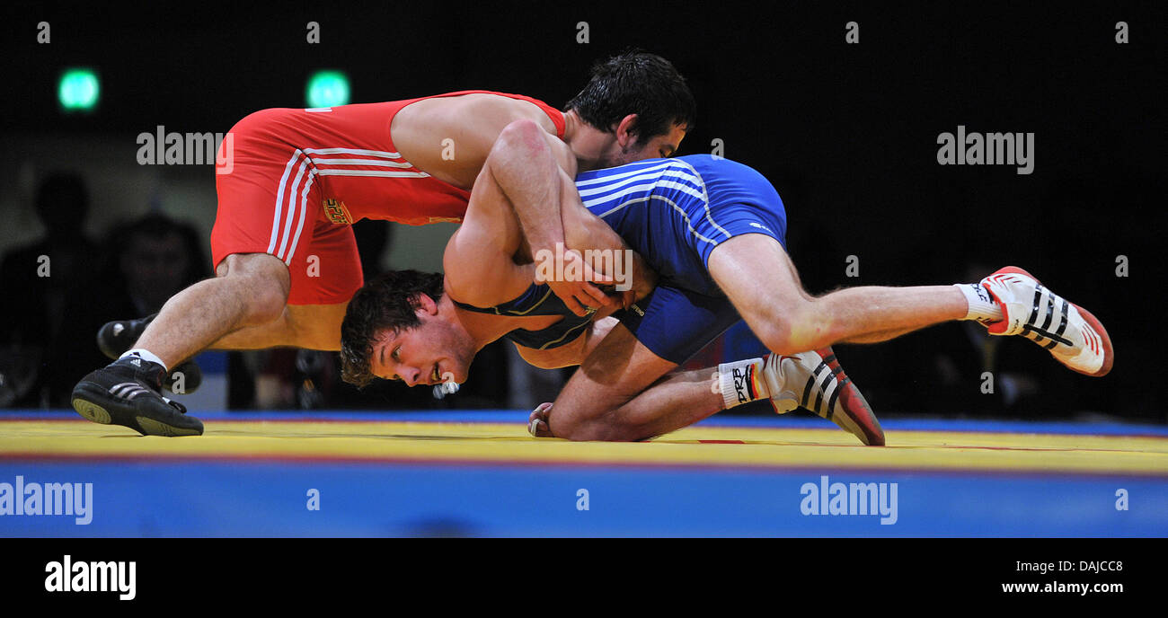 Turkey's Mustafa Saglam (red) takes on Germany's Erik Weiss during the ...