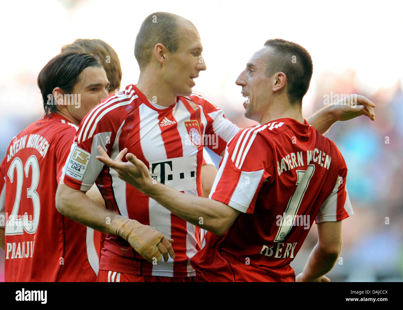 Munich's Franck Ribery (R) congratulates his team-mate Arjen Robben on ...
