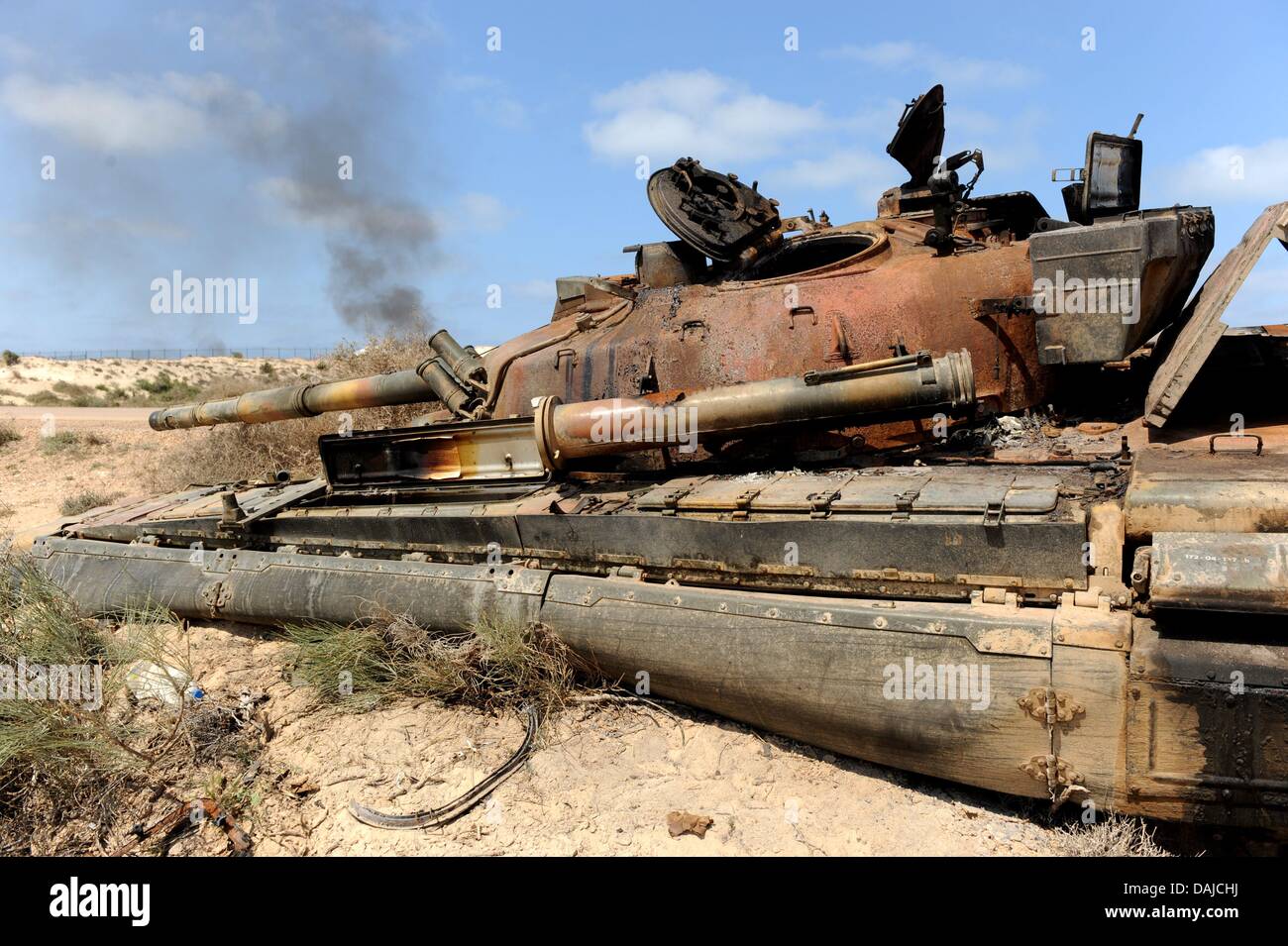 A destroyed tank sits next to an oil terminal on the mediteranean coast ...