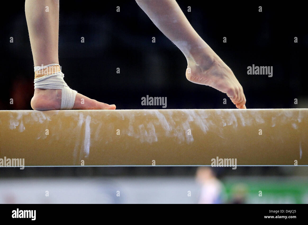A gymnast trains on the balance beam during the Gymnastics European ...