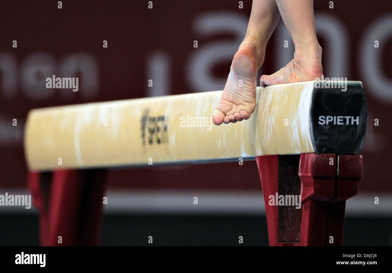 A gymnast trains on the balance beam during the Gymnastics European ...