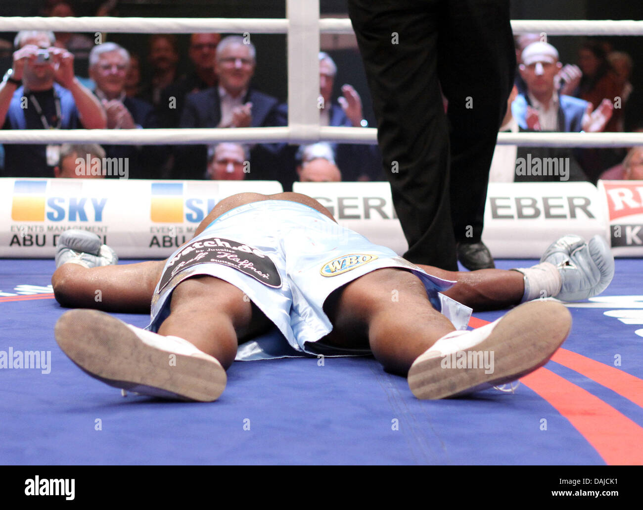 Nigerian boxer Samuel Peter falls to the floor after a blow from Robert ...