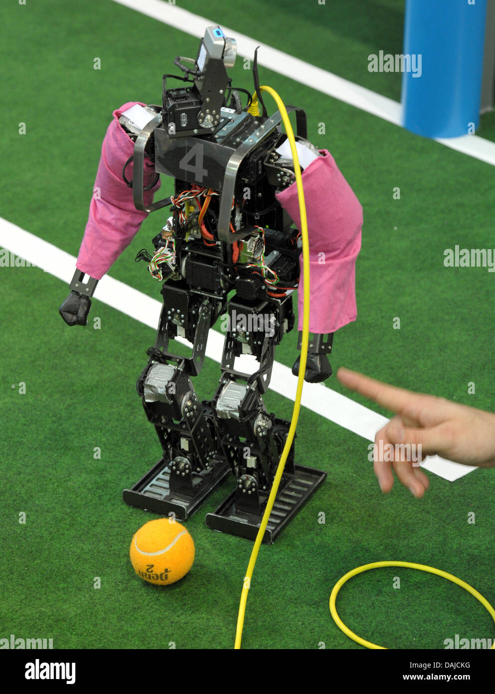 A robot developed by Darmstadt University of Technology (L) controls ...