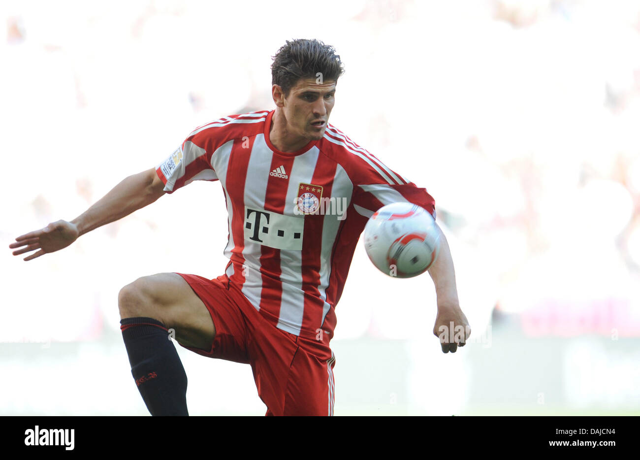 Munich's Mario Gomez controls the ball during German Bundesliga match ...