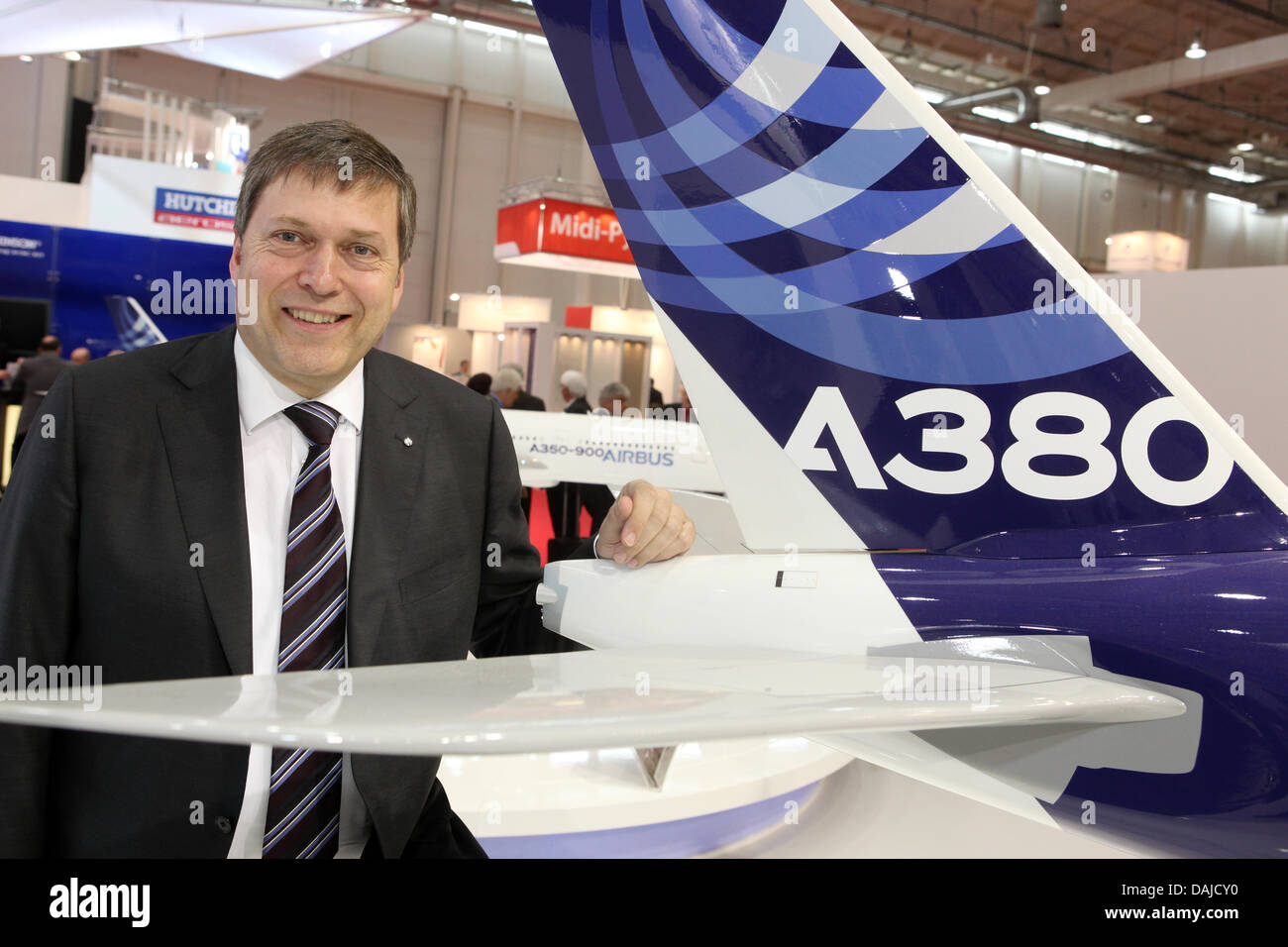 Airbus production executive Guenter Butschek stands next to an A380 ...