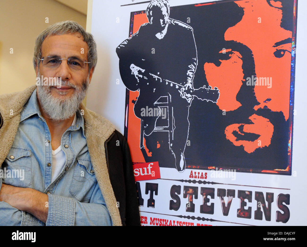 Yusuf Islam alias Cat Stevens in front of his tour poster in a hotel ...