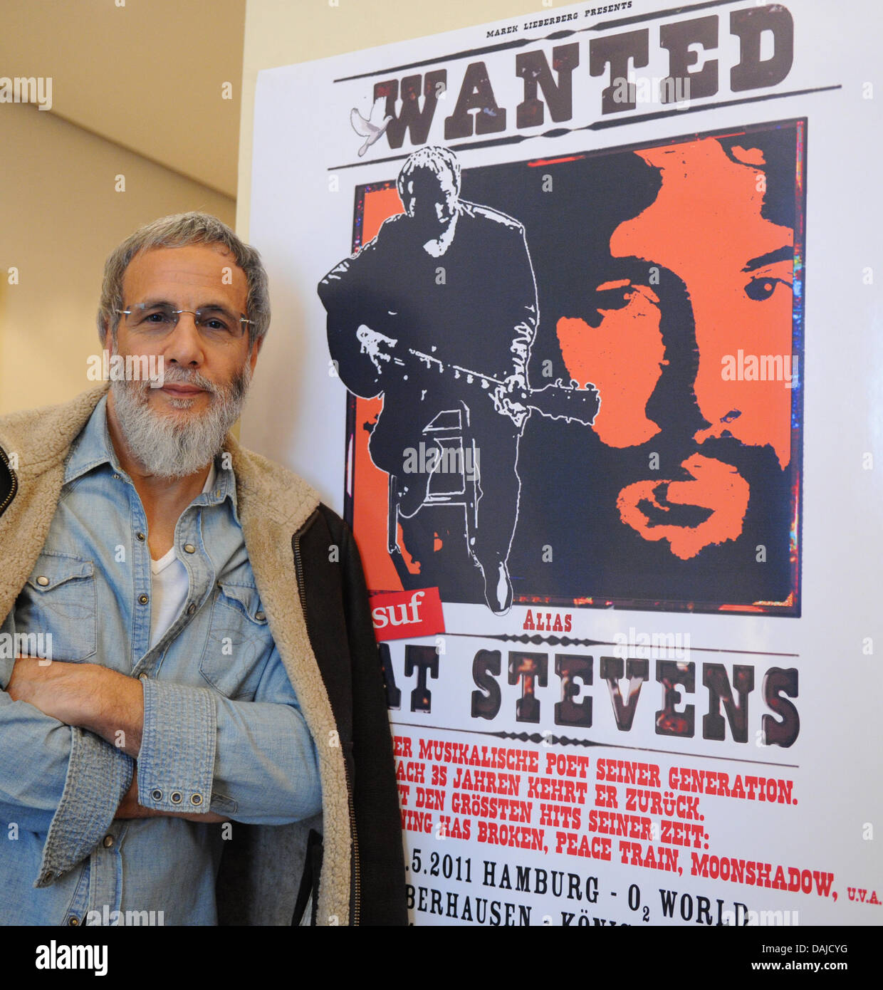 Yusuf Islam alias Cat Stevens in front of his tour poster in a hotel ...