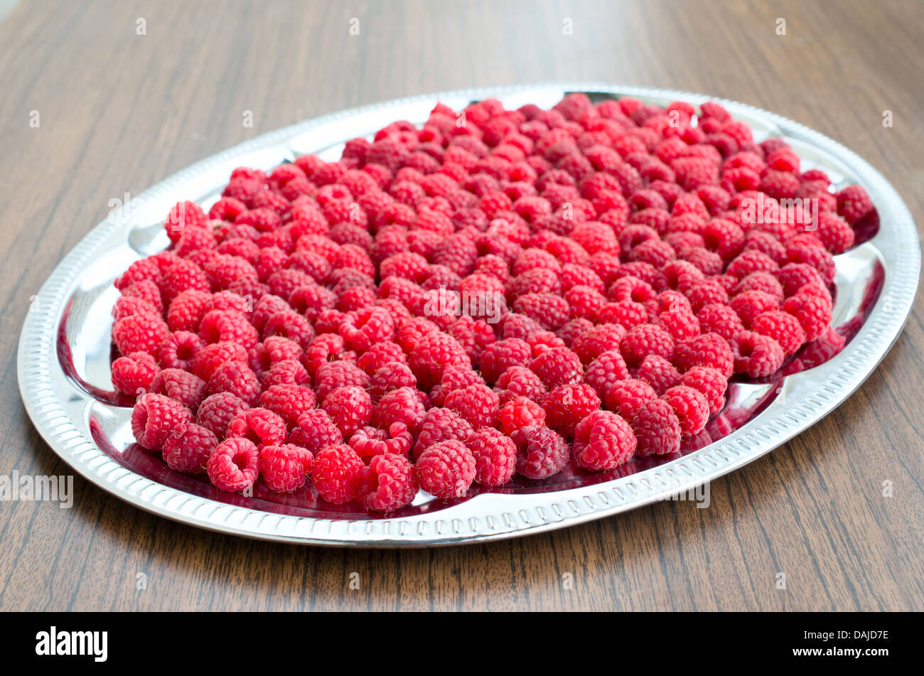 raspberries are on a metal tray Stock Photo - Alamy
