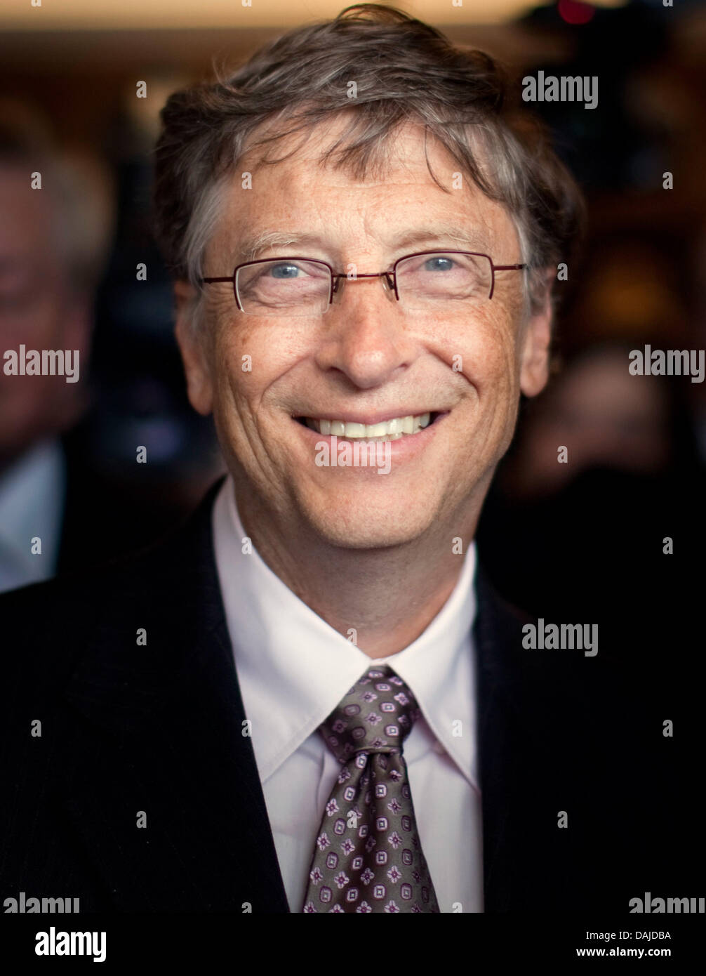 Microsoft founder Bill Gates smiles after signing a cooperation ...