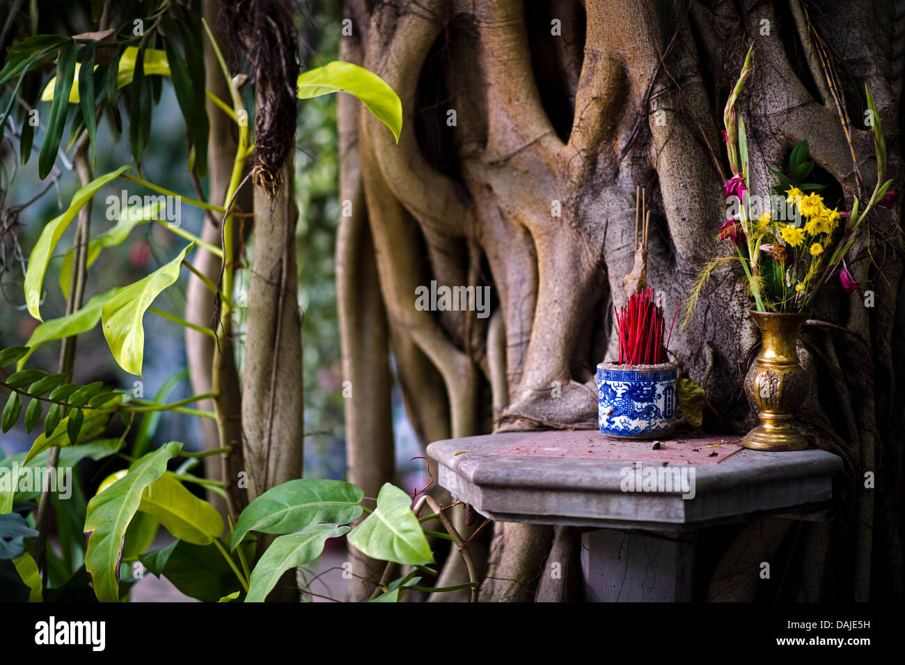 A sacrificial Buddhist offering stand on a little table on display in ...