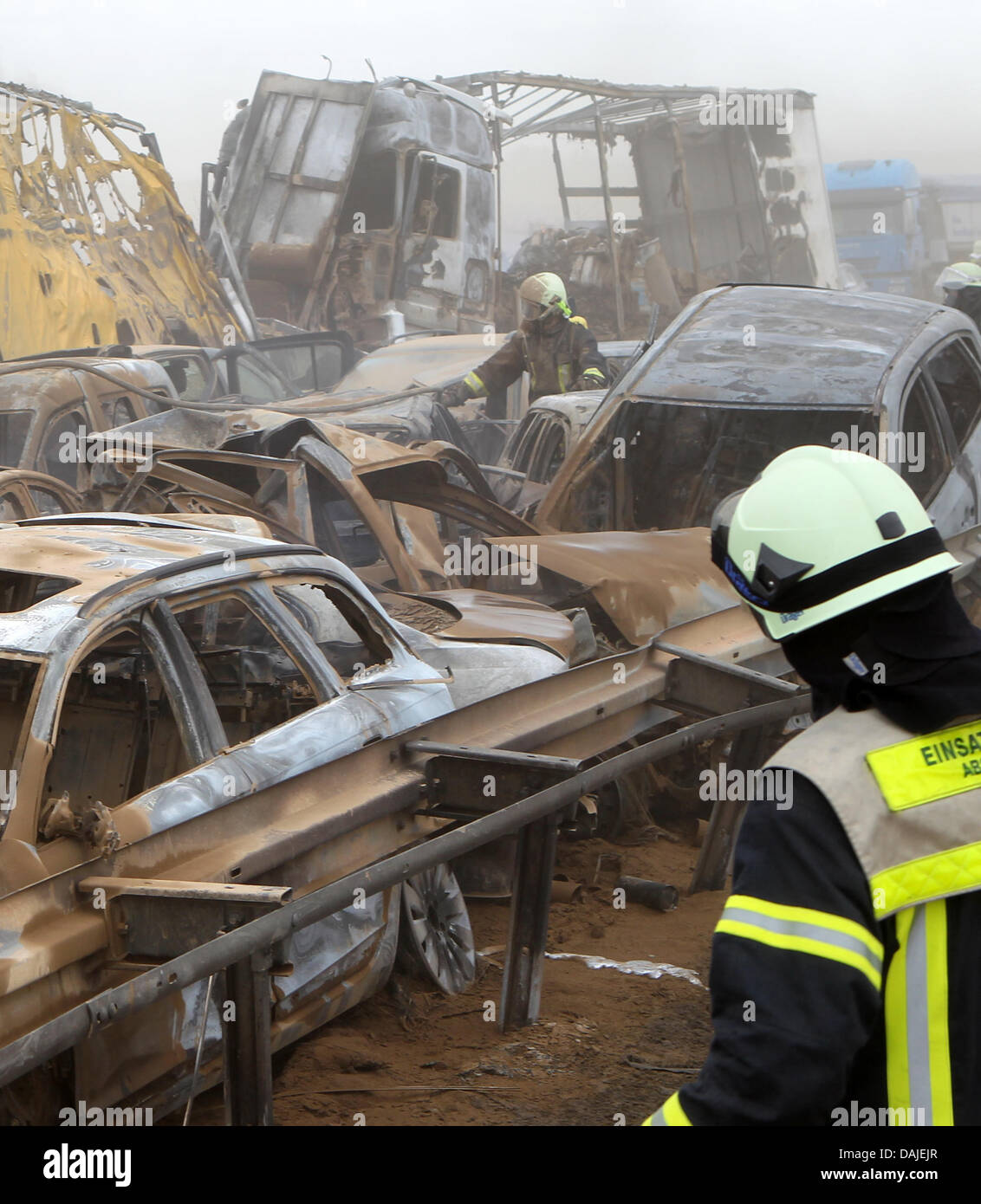 Firemen are in operation at a multiple car pile-up on Autobahn A19 in ...