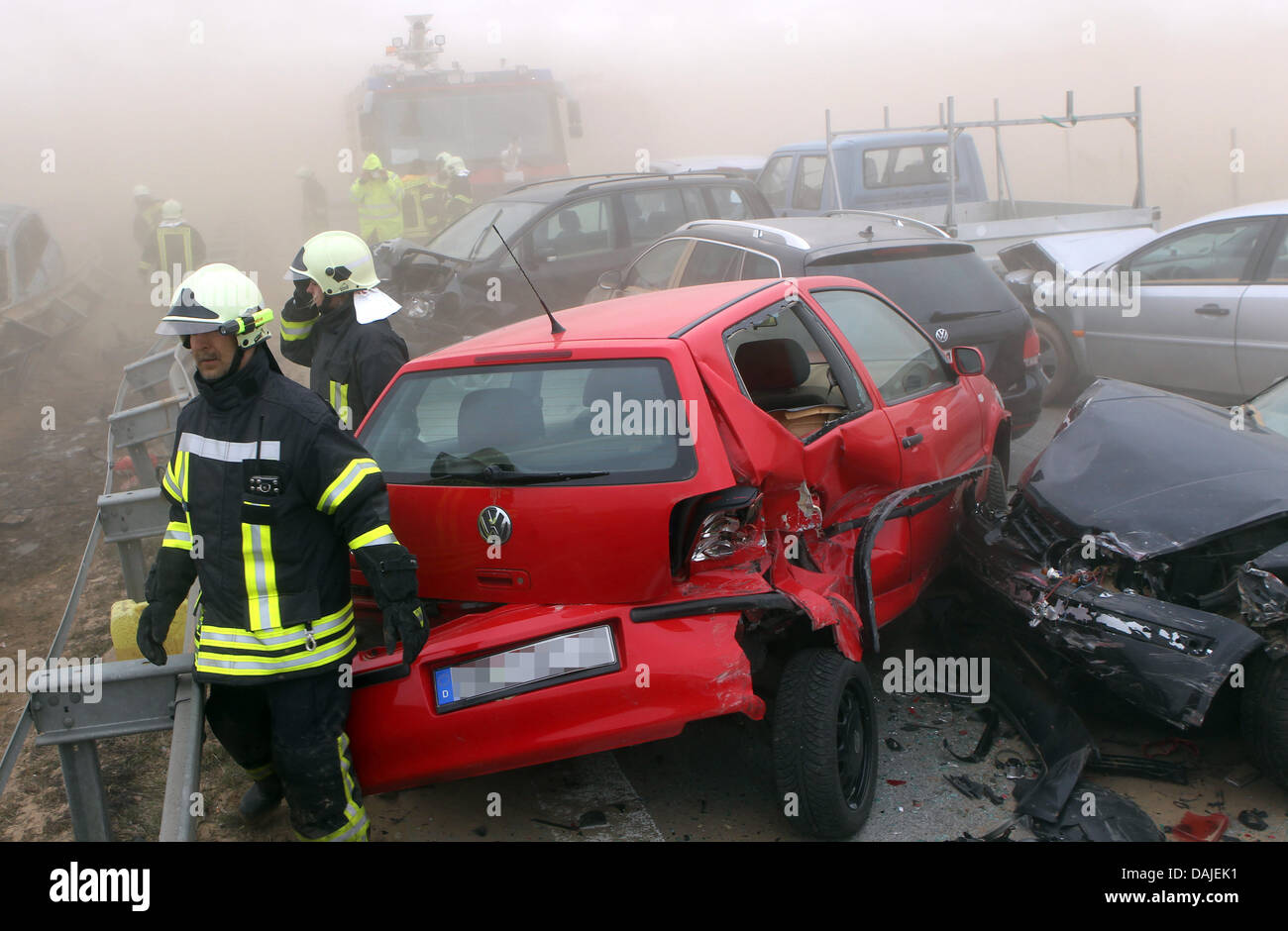 Firemen are in operation at a multiple car pile-up on Autobahn A19 in ...